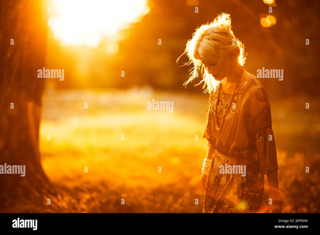 Beautiful woman at sunset Stock Photo - Alamy