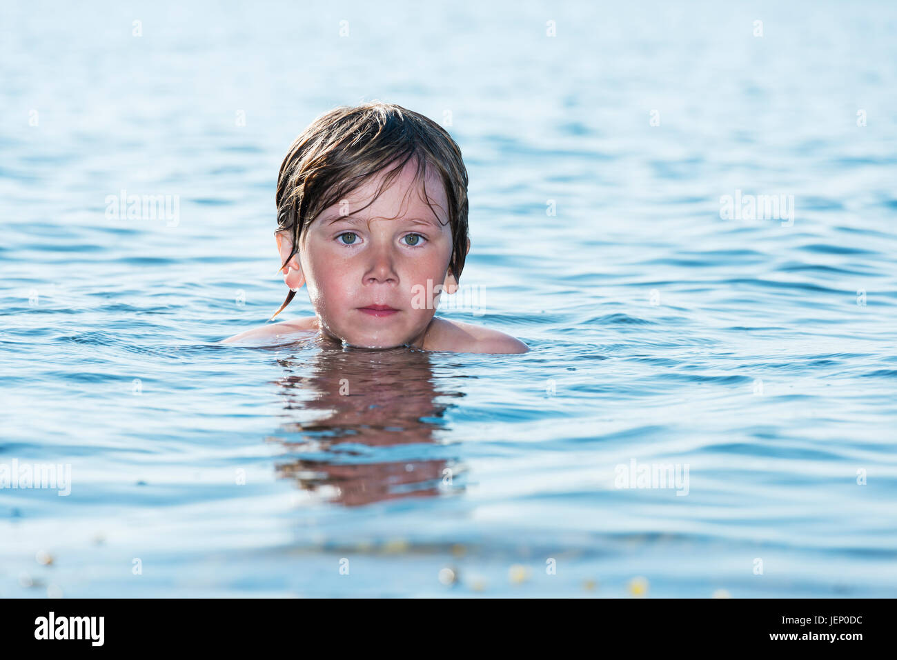 Portrait of boy in water Stock Photo - Alamy