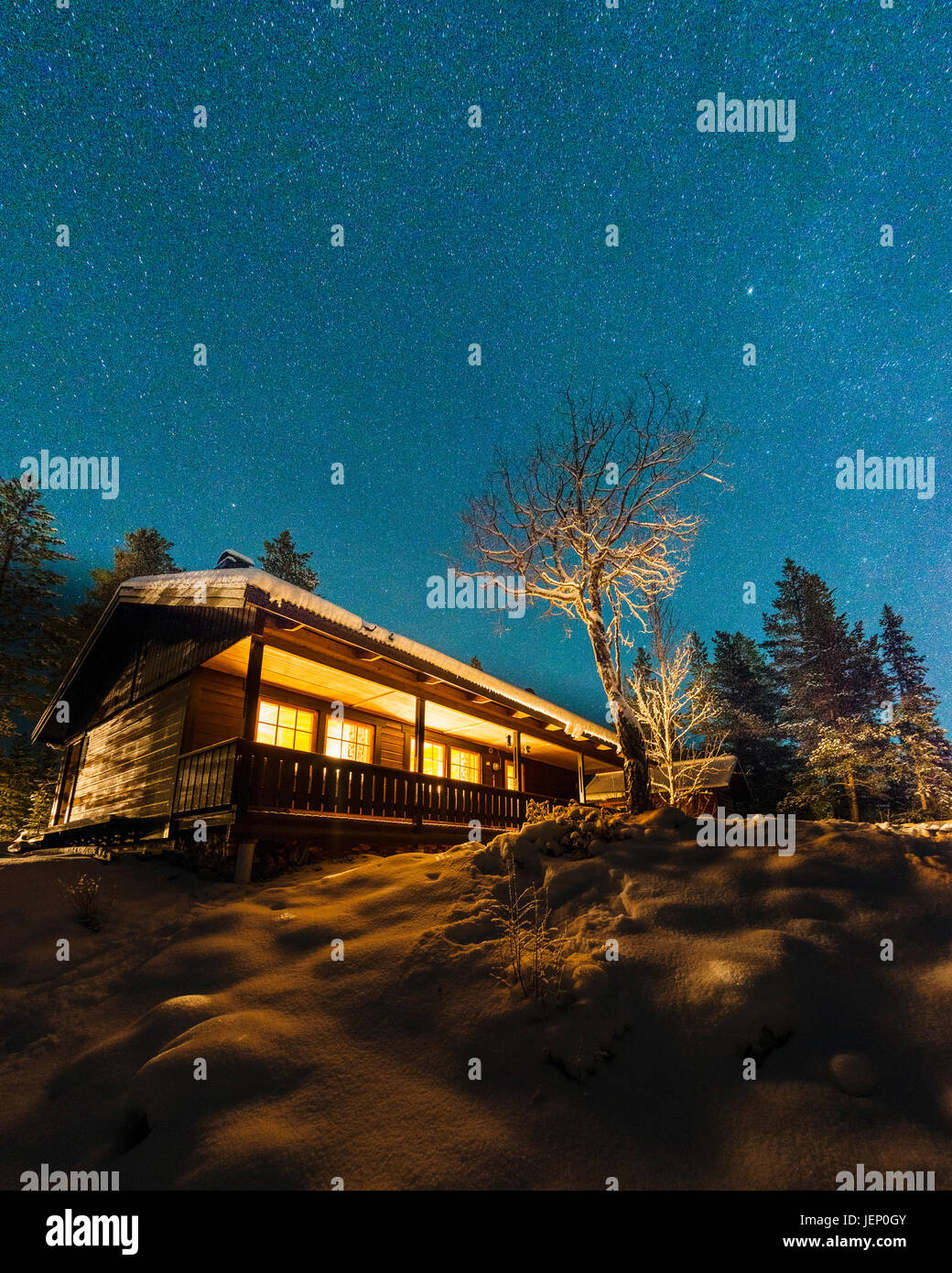 Illuminated house at night Stock Photo - Alamy