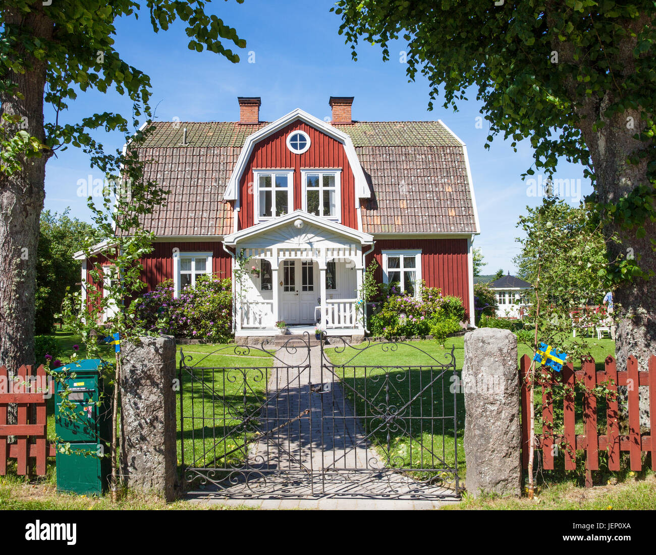 Gate in front of wooden house Stock Photo - Alamy
