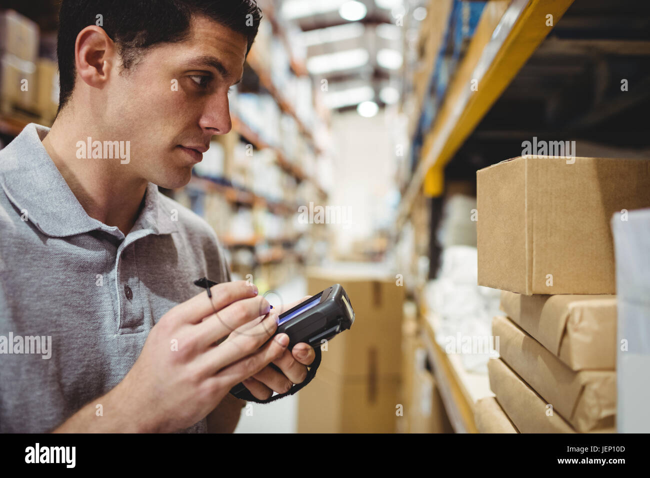 Worker scanning box hi-res stock photography and images - Alamy