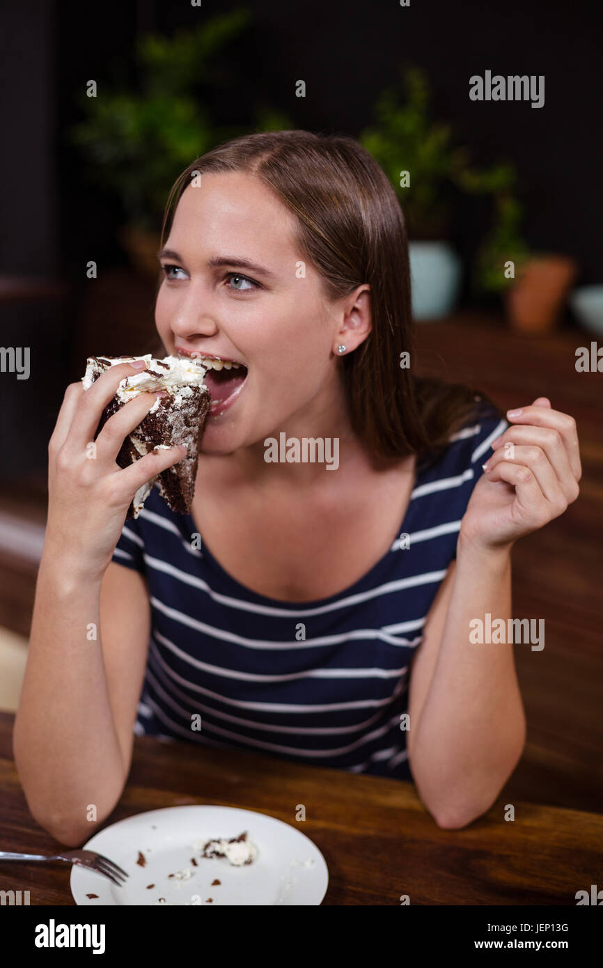 Caucasian business woman eating cake hi-res stock photography and ...