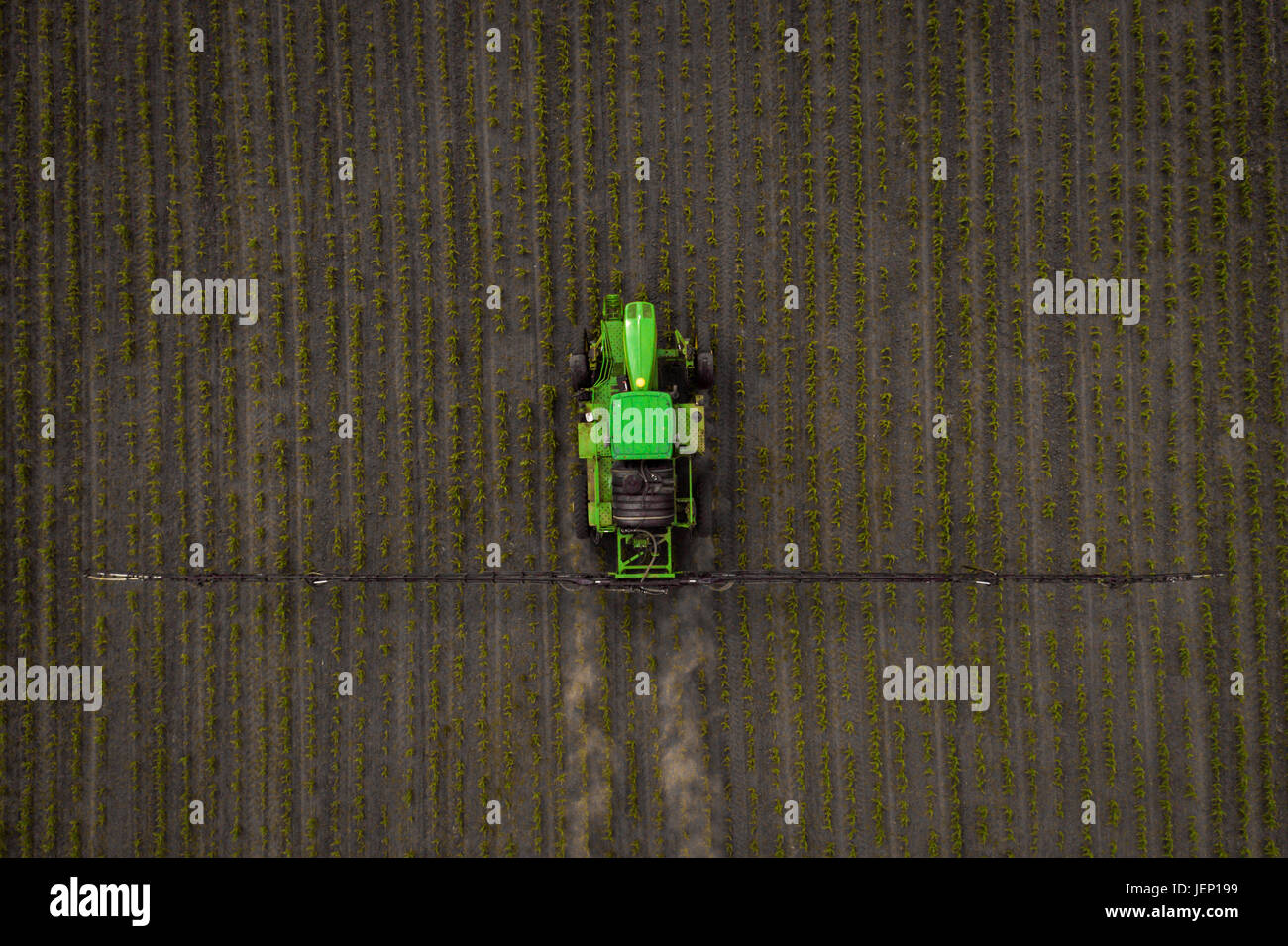 Aerial view green tractor spraying hi-res stock photography and images ...