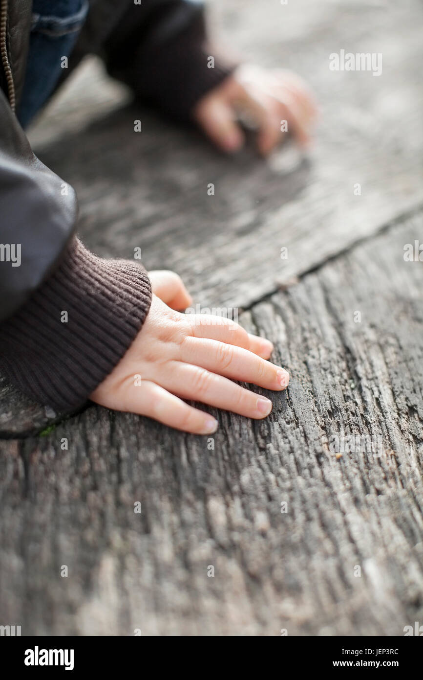 Childs hand on wood Stock Photo - Alamy