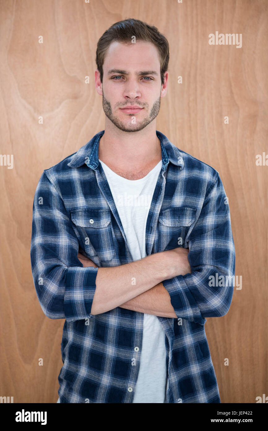 Handsome hipster with arms crossed Stock Photo - Alamy