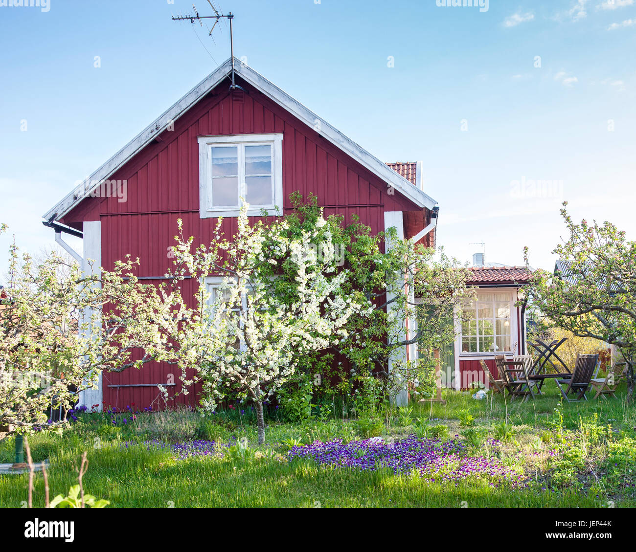 Wooden house at spring Stock Photo - Alamy