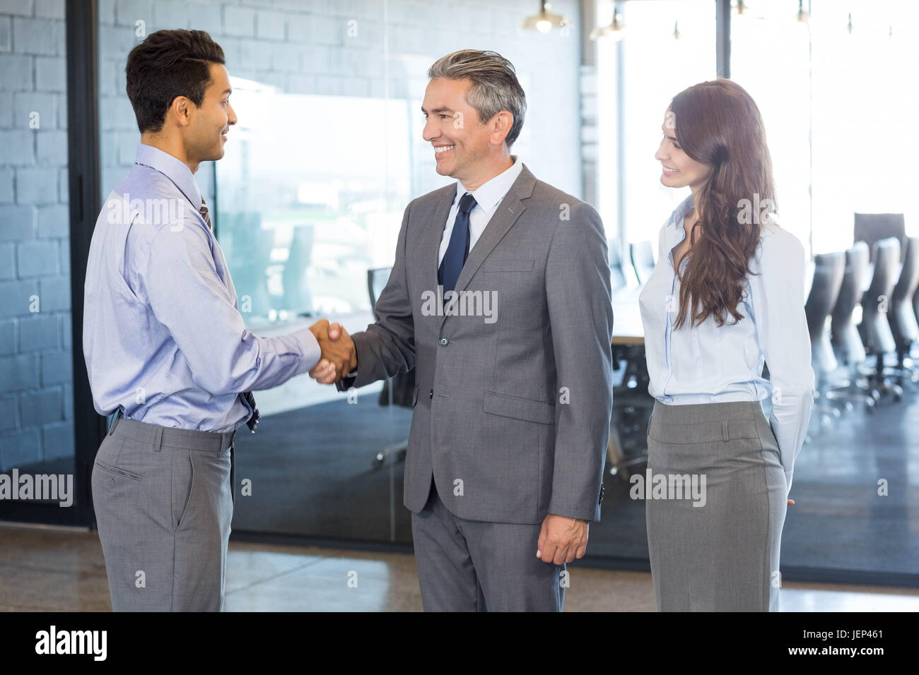 Business team interacting in office Stock Photo - Alamy
