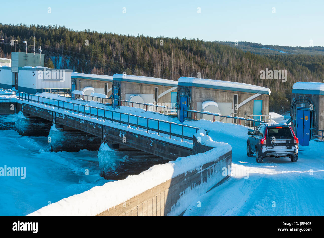 Car driving over dam Stock Photo - Alamy