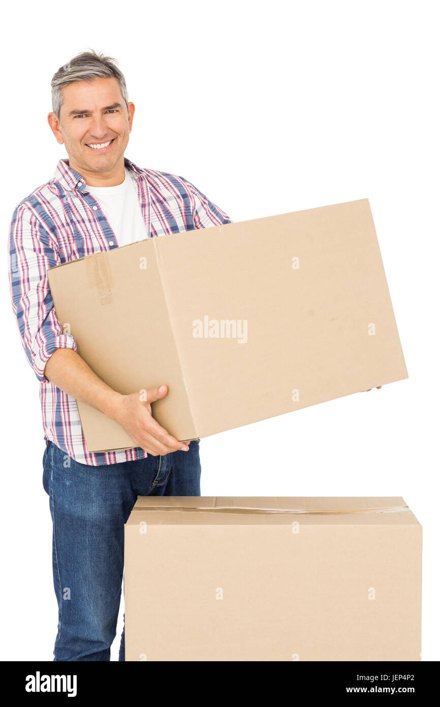 Happy man posing with moving boxes Stock Photo - Alamy