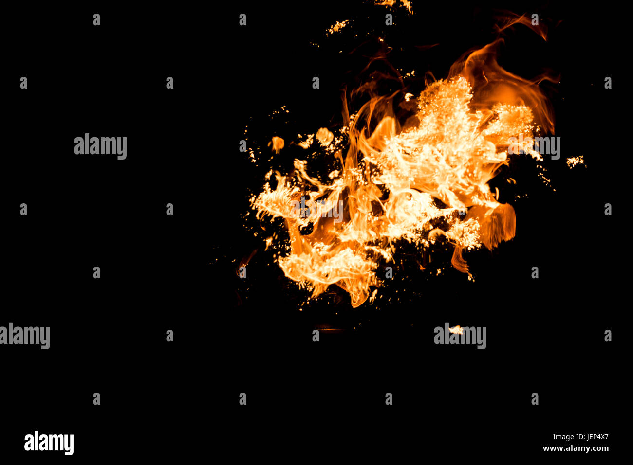 Diesel fuel explosion isolated on black background with yellow orange ...