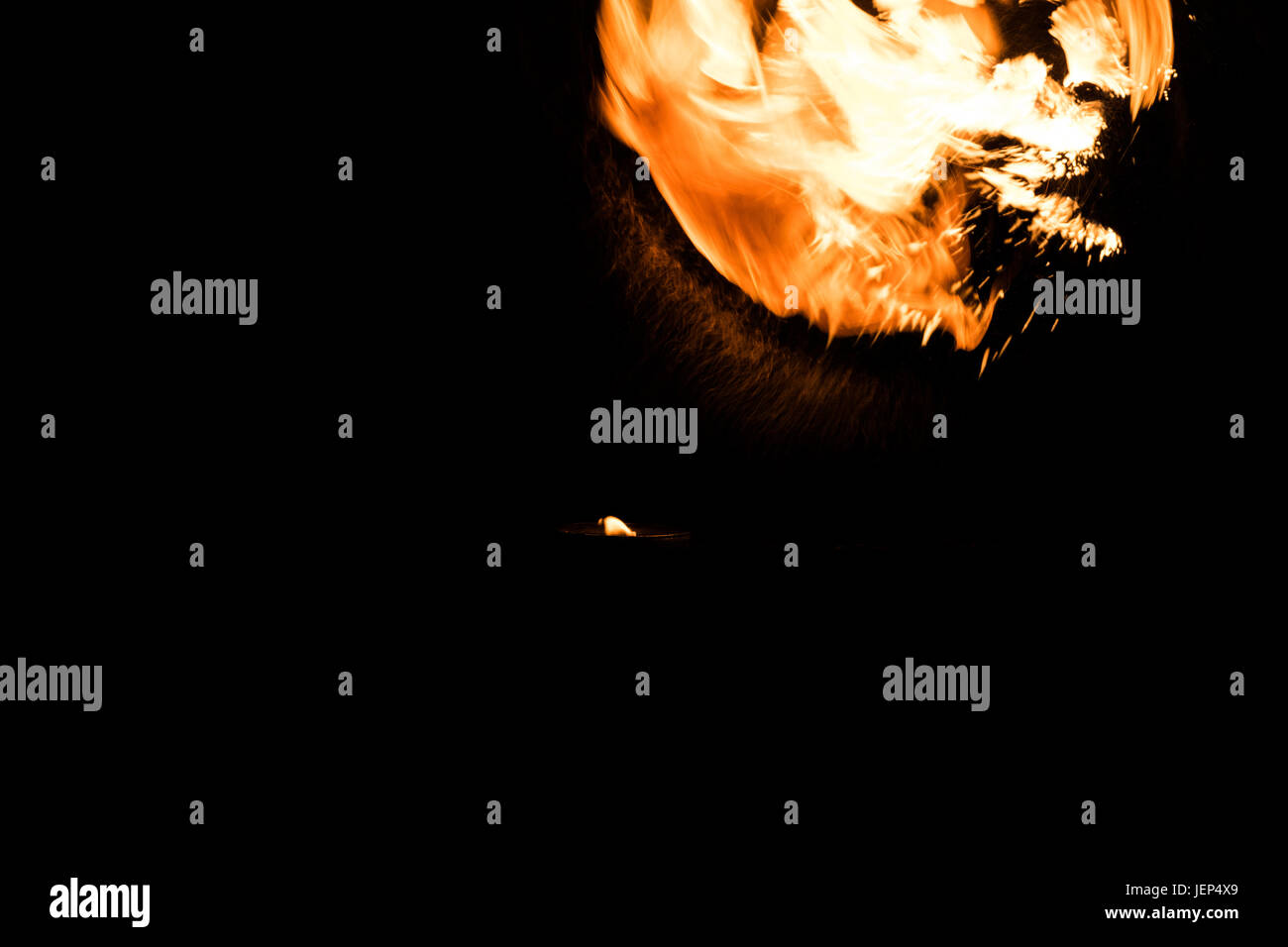 Diesel fuel explosion isolated on black background with yellow orange ...