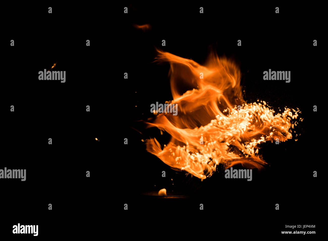 Diesel fuel explosion isolated on black background with yellow orange ...