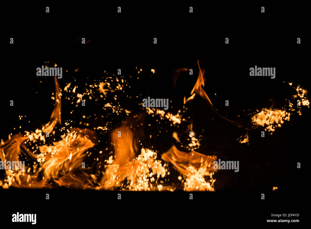 Diesel fuel explosion isolated on black background with yellow orange ...