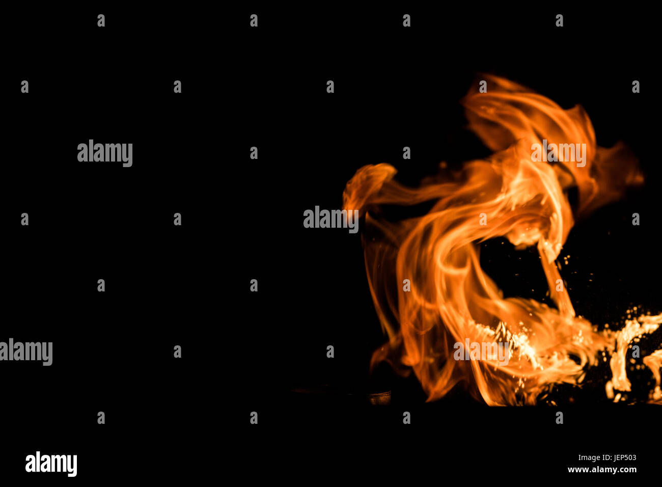 Diesel fuel explosion isolated on black background with yellow orange ...