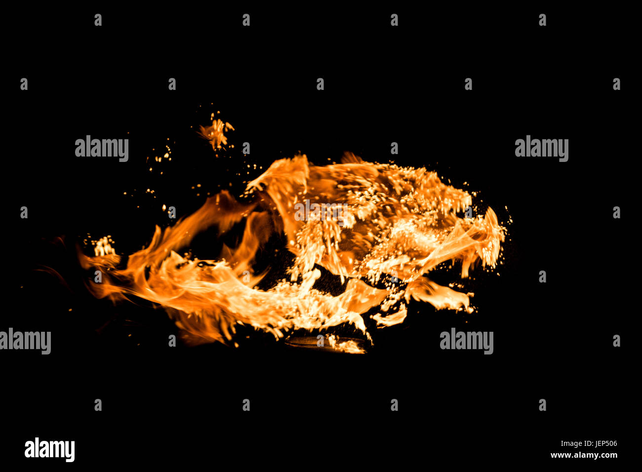 Diesel fuel explosion isolated on black background with yellow orange ...