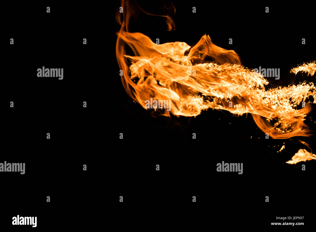 Diesel fuel explosion isolated on black background with yellow orange ...