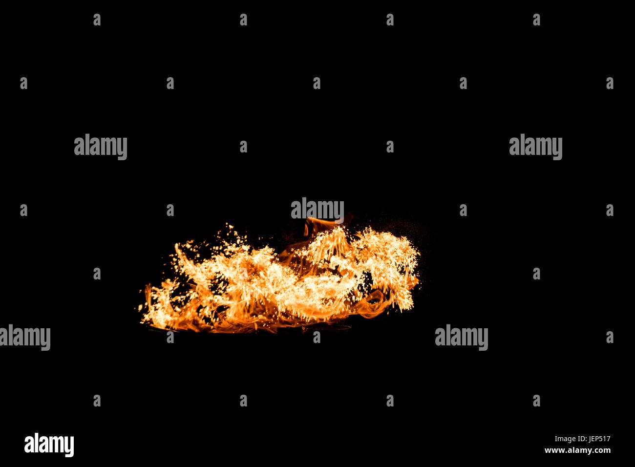 Diesel fuel explosion isolated on black background with yellow orange ...