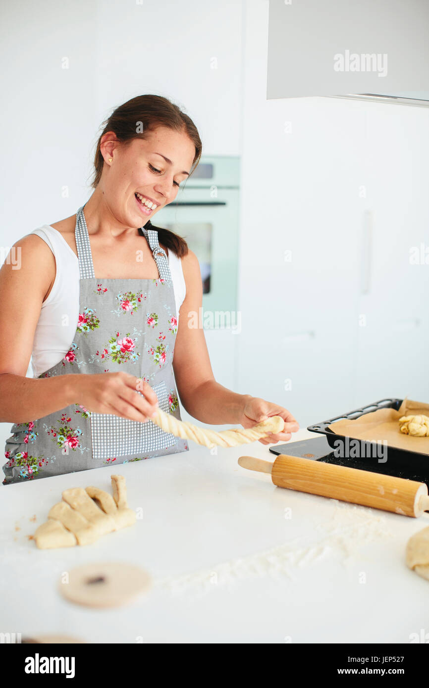 Smiling woman baking Stock Photo - Alamy