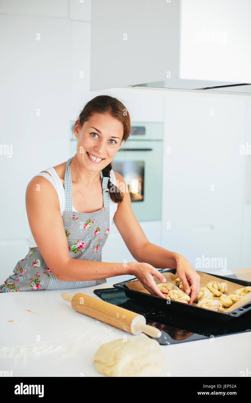 Smiling woman baking Stock Photo - Alamy