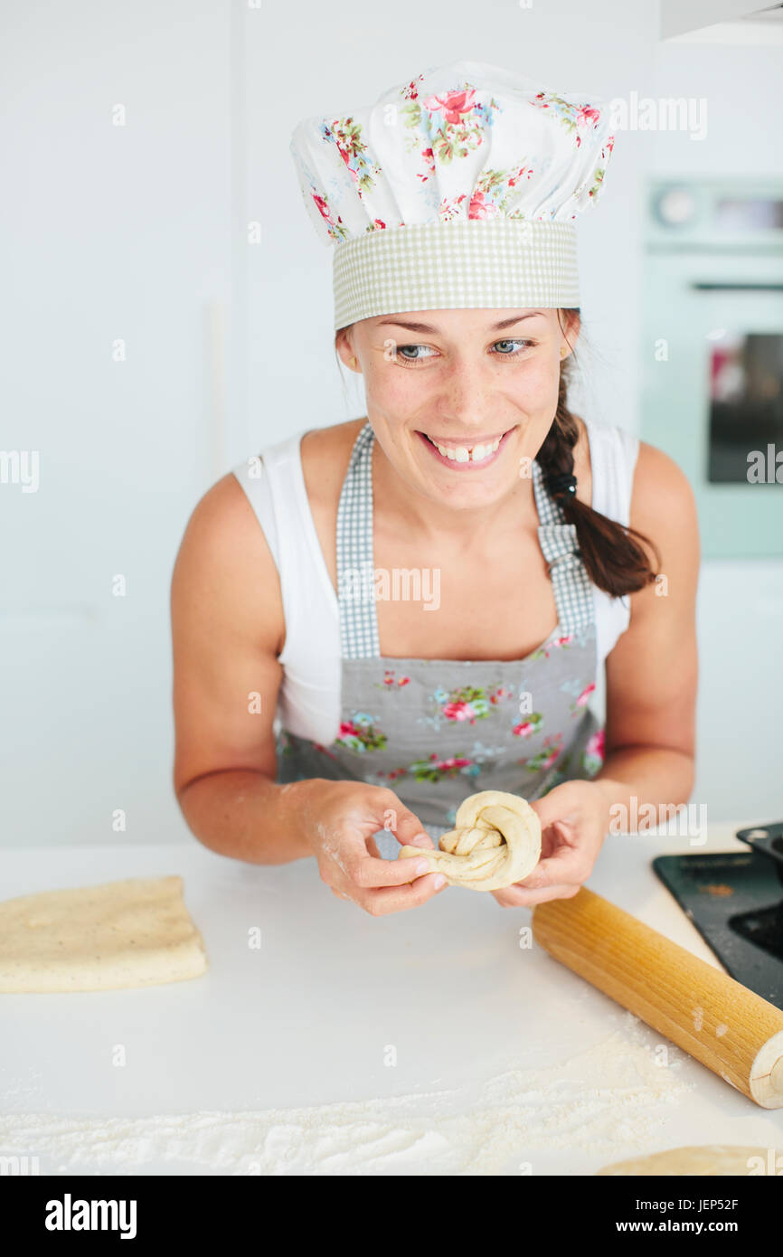 Smiling woman baking Stock Photo - Alamy