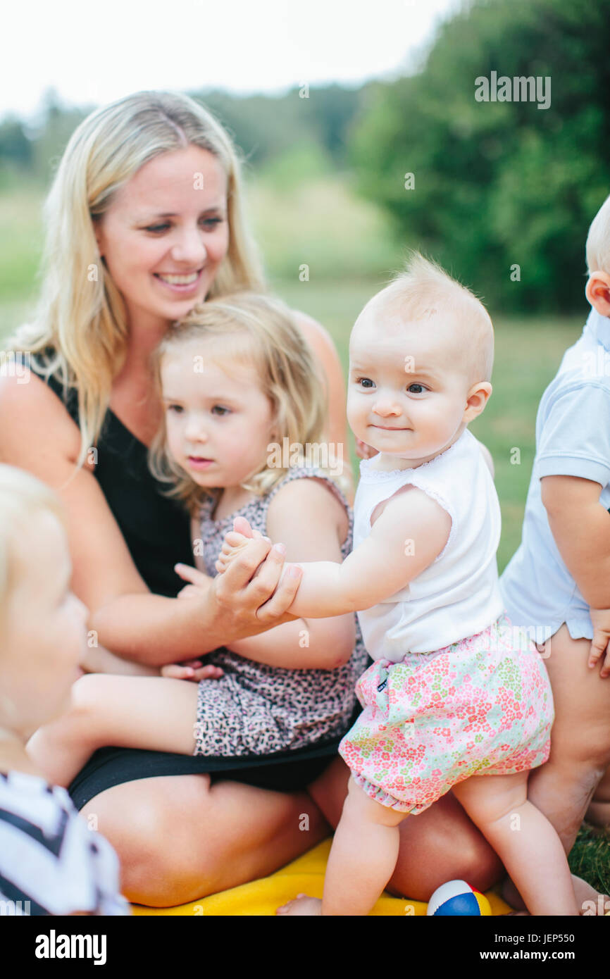 Mother with two children Stock Photo - Alamy