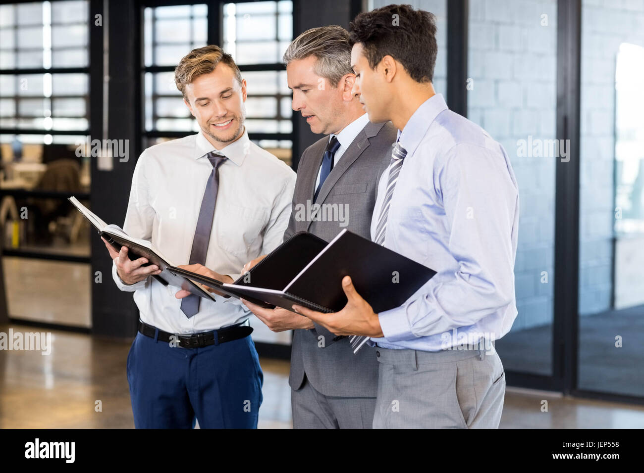 Business team with document and organizer Stock Photo - Alamy