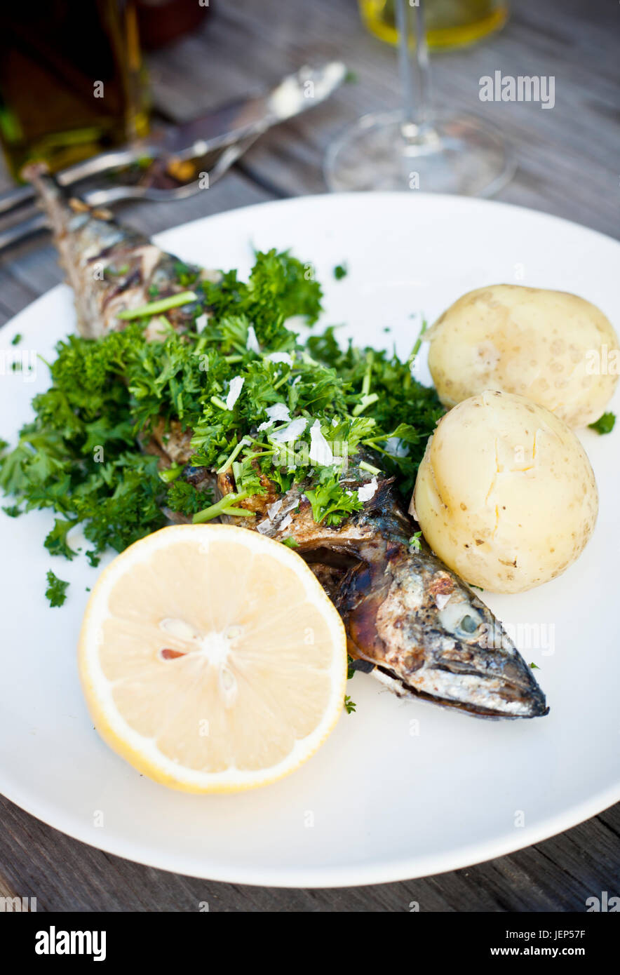 Grilled fish on plate Stock Photo - Alamy