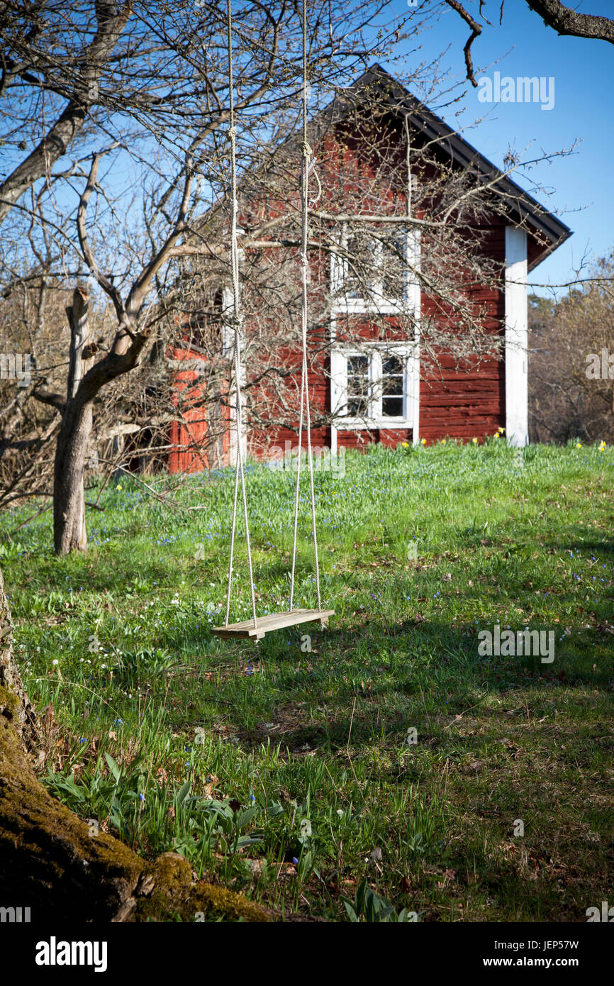 Wooden cottage lawn swing hi-res stock photography and images - Alamy