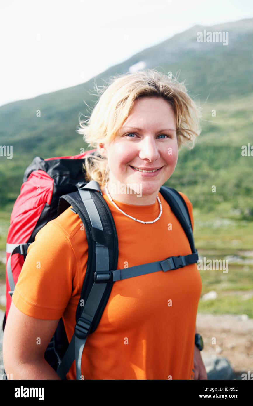 Young woman wearing backpack Stock Photo - Alamy