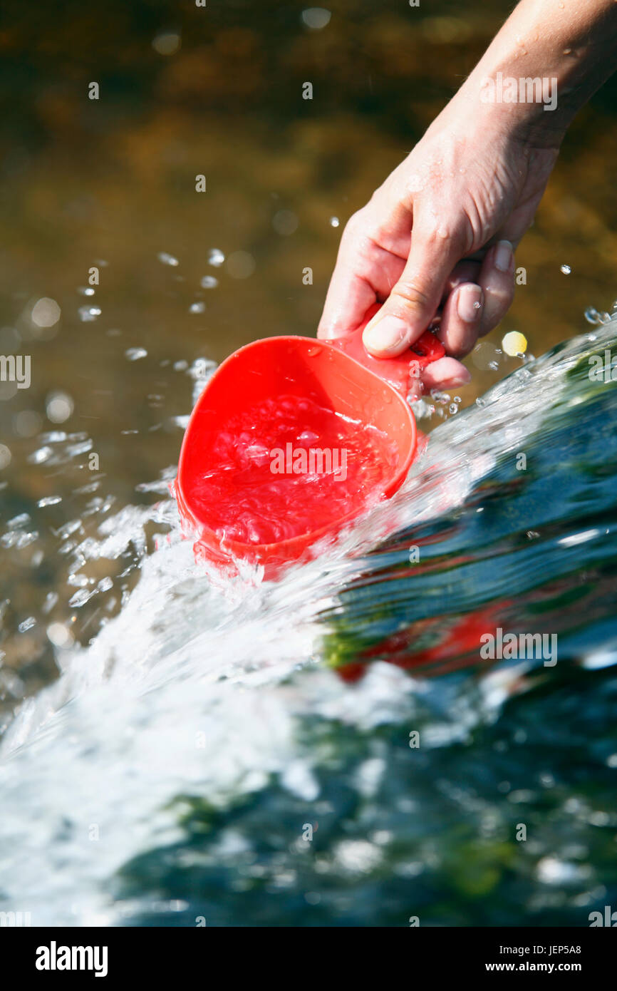 Hand taking water from river Stock Photo - Alamy