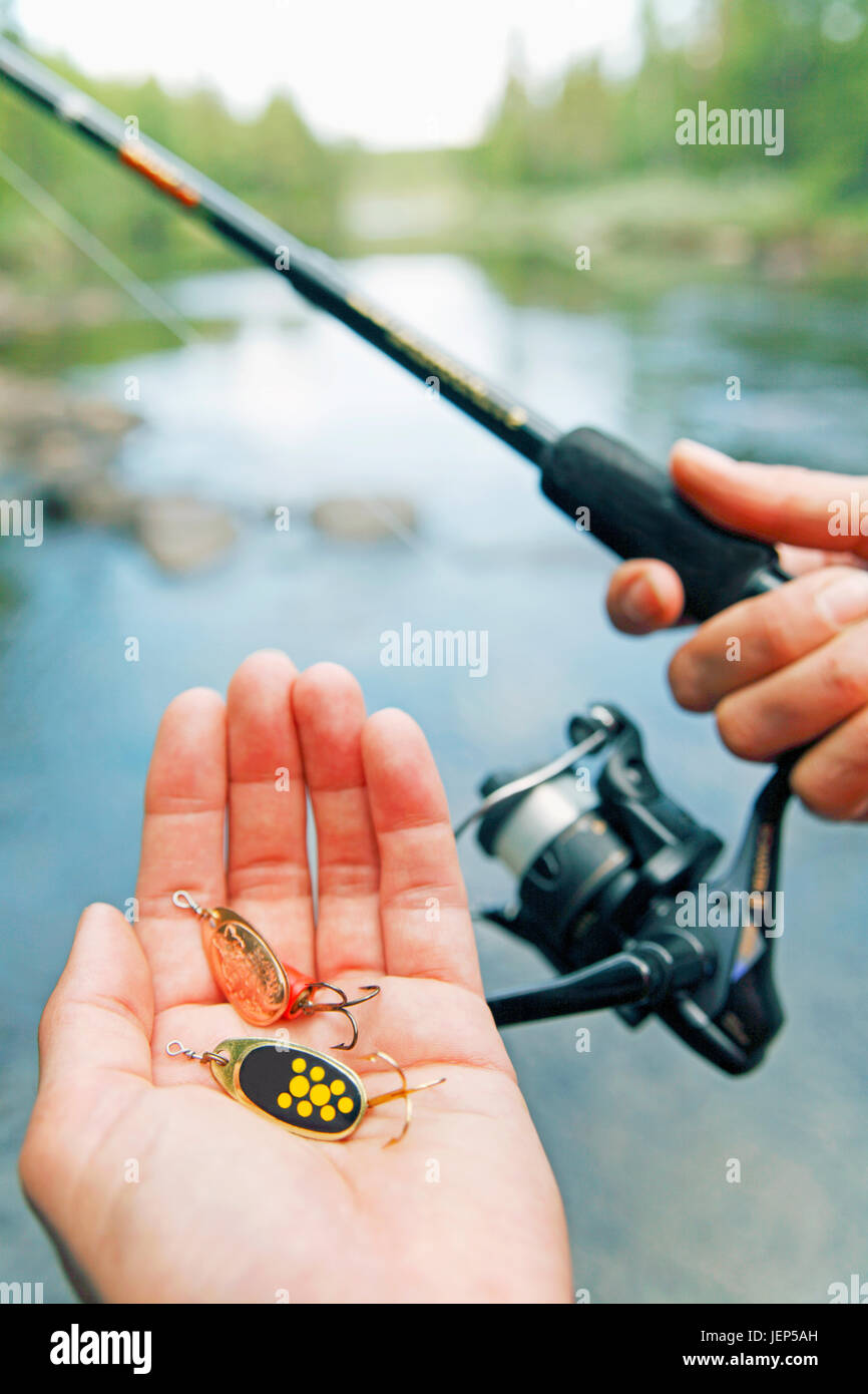 hand with fishing hooks. close-up Stock Photo - Alamy
