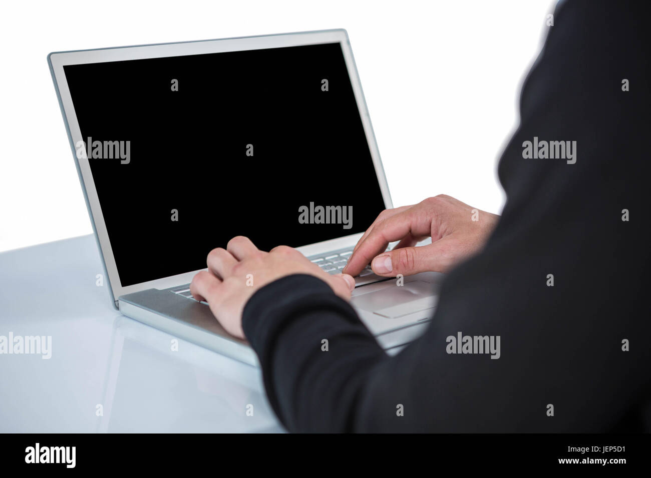 Handsome man in black hoodie using laptop Stock Photo - Alamy