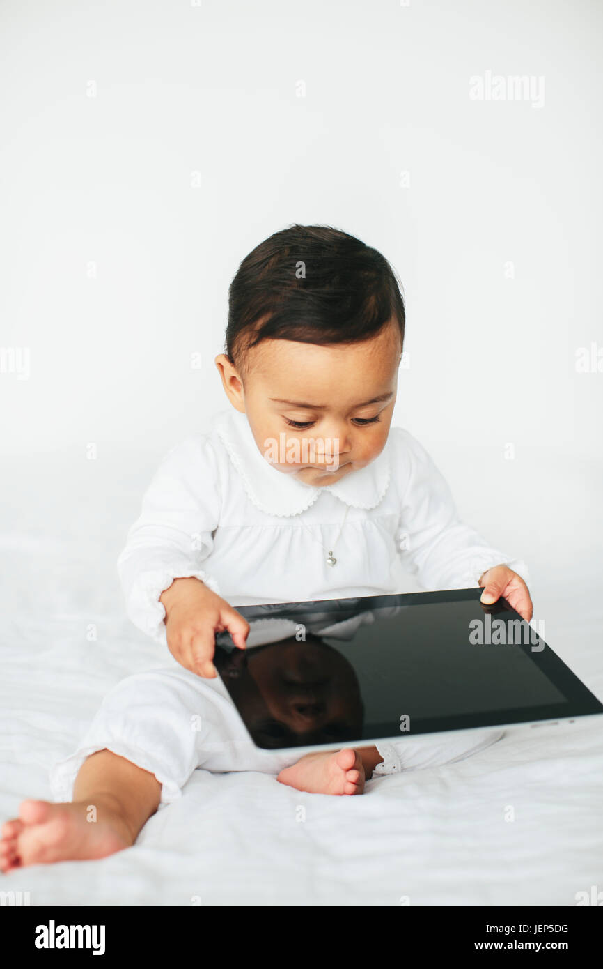 Baby with digital tablet Stock Photo - Alamy