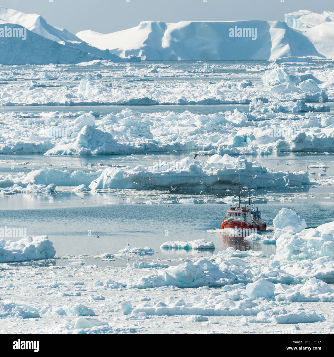 Boat in frozen sea Stock Photo - Alamy