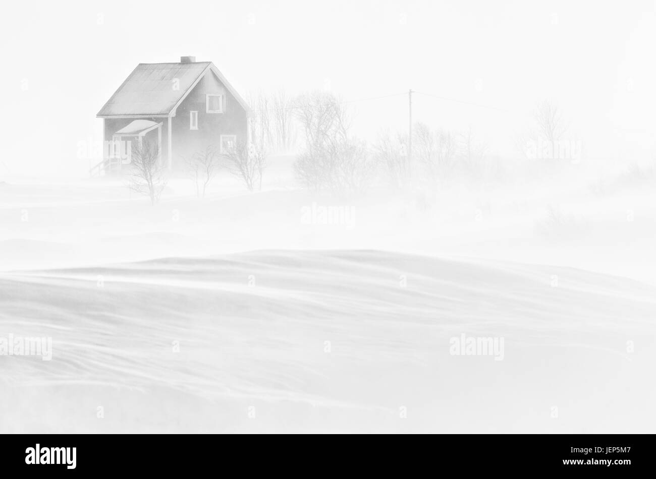 Snowy landscape with wooden house Stock Photo - Alamy