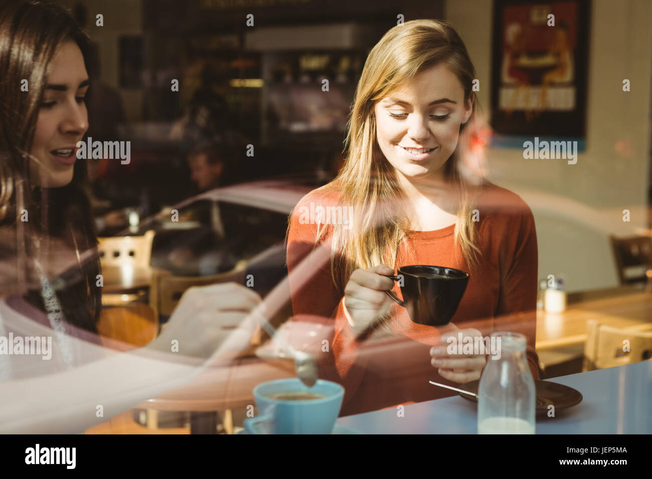Friends chatting over coffee Stock Photo - Alamy