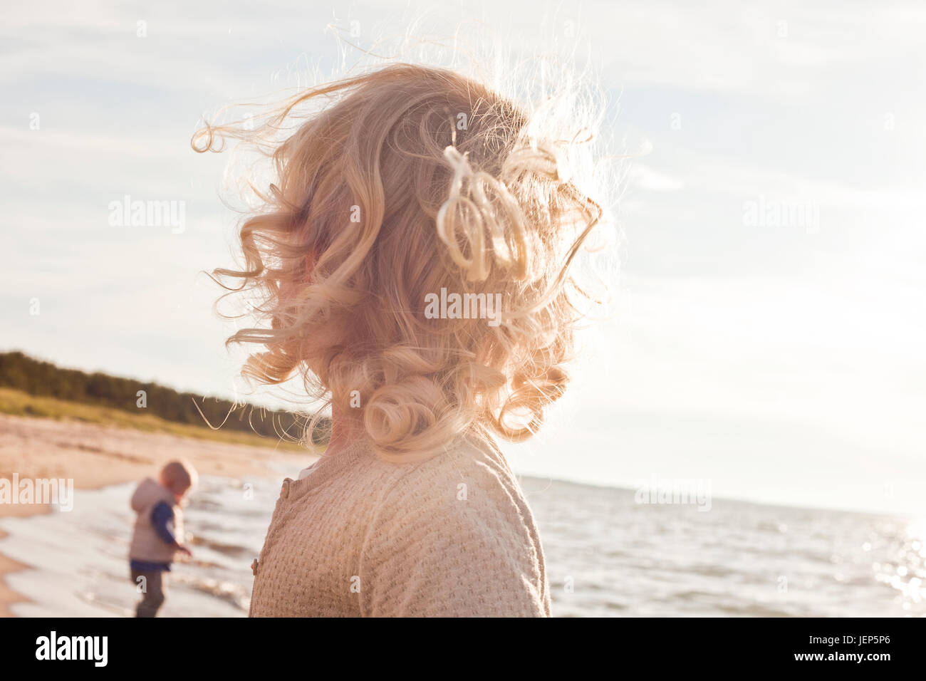 Child looking at sea Stock Photo - Alamy
