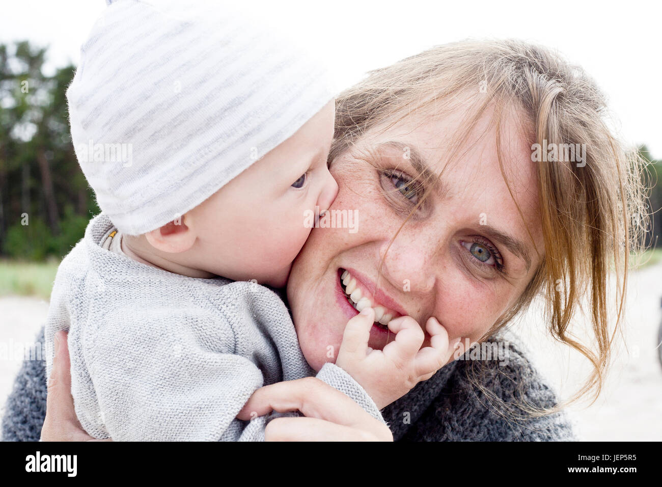 Smiling mother with baby boy Stock Photo - Alamy