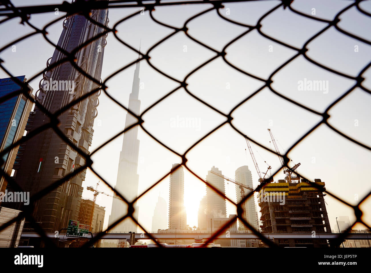 Skyscrapers, chain-link fence on background Stock Photo - Alamy