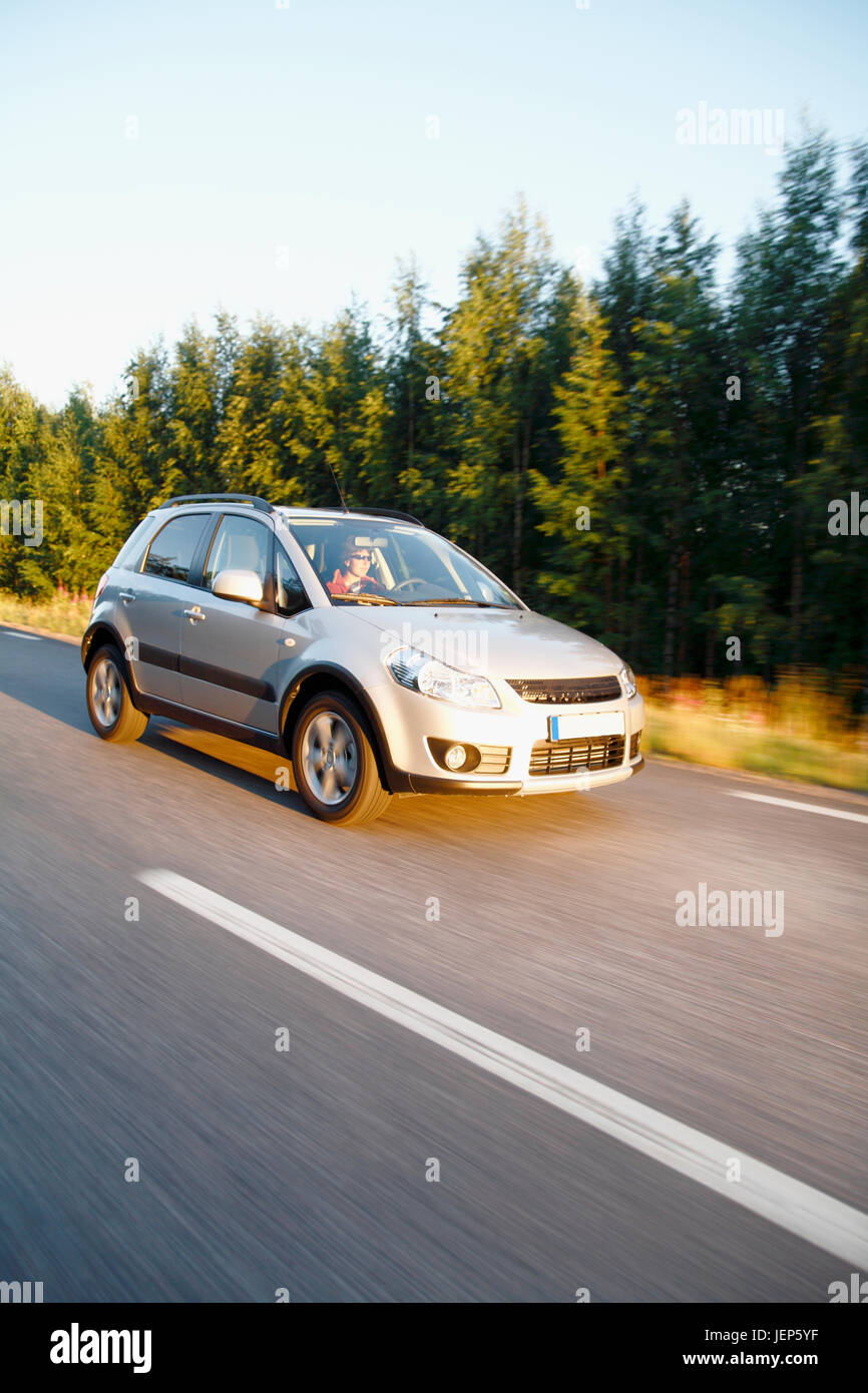 Car on country road Stock Photo - Alamy