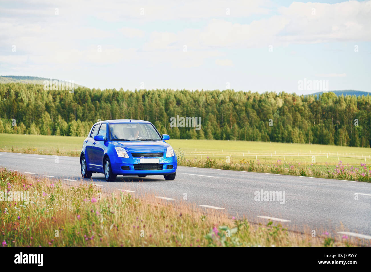 Car on country road Stock Photo - Alamy