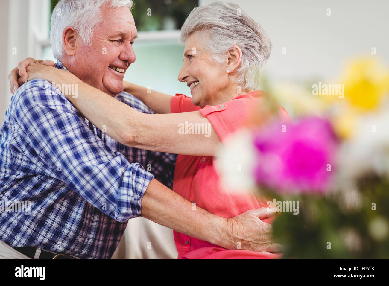 Happy old couple embracing comfortable hi-res stock photography and ...