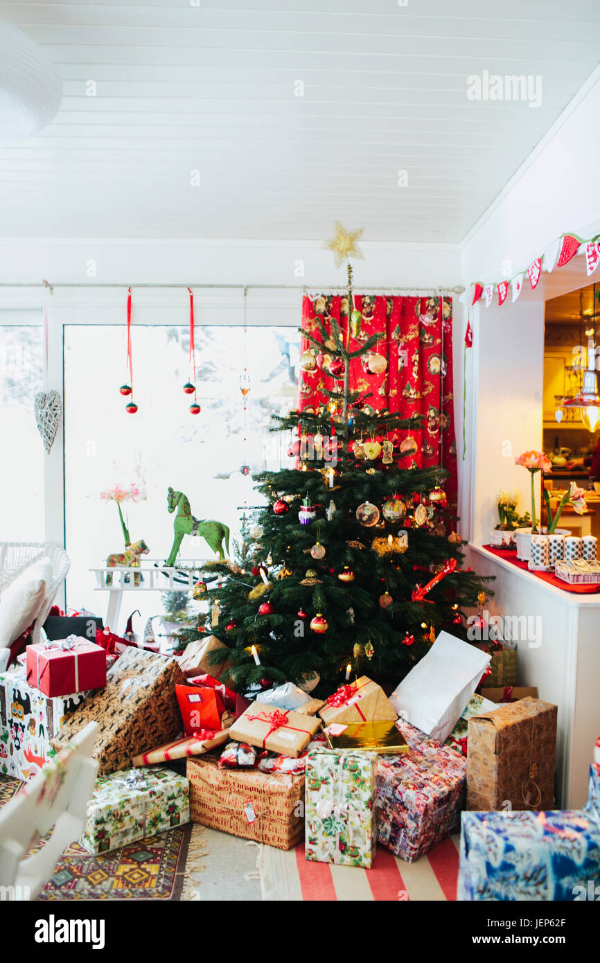Christmas tree in living room Stock Photo - Alamy