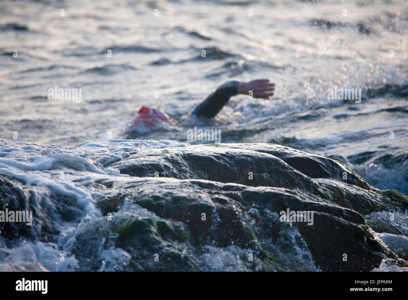 Person swimming in river Stock Photo - Alamy