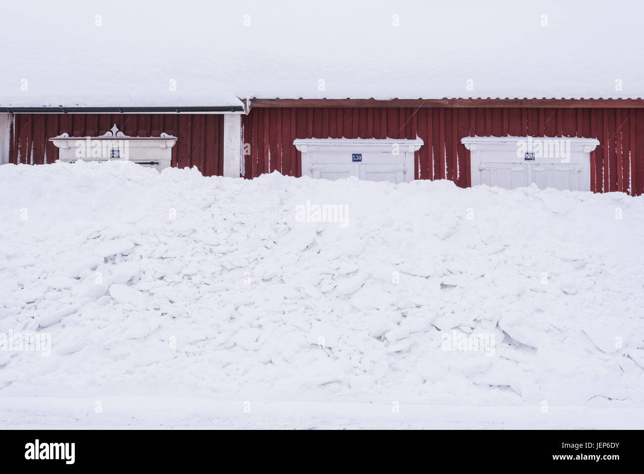 Wooden buildings covered in snow Stock Photo - Alamy