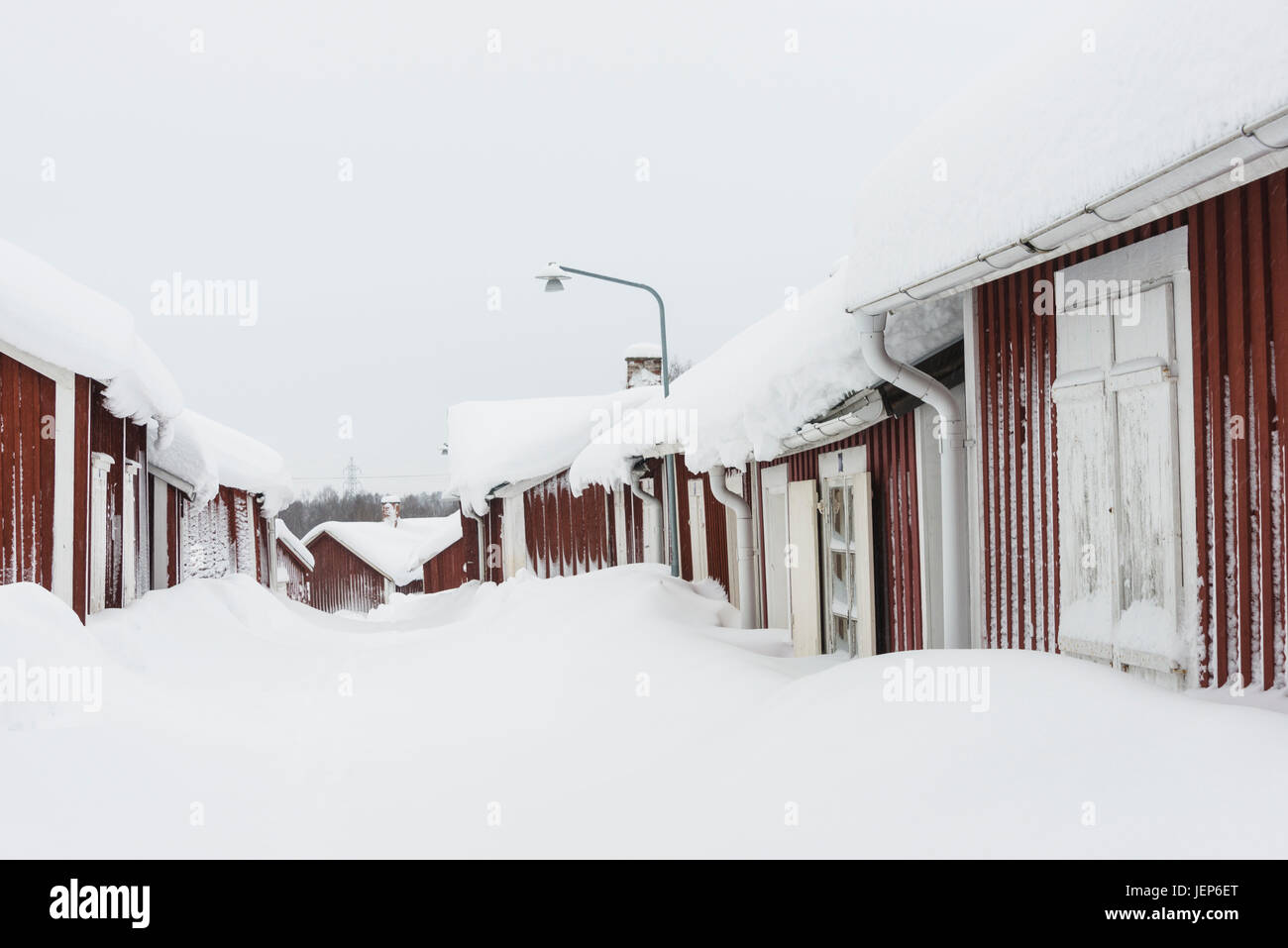 Wooden buildings covered in snow Stock Photo - Alamy
