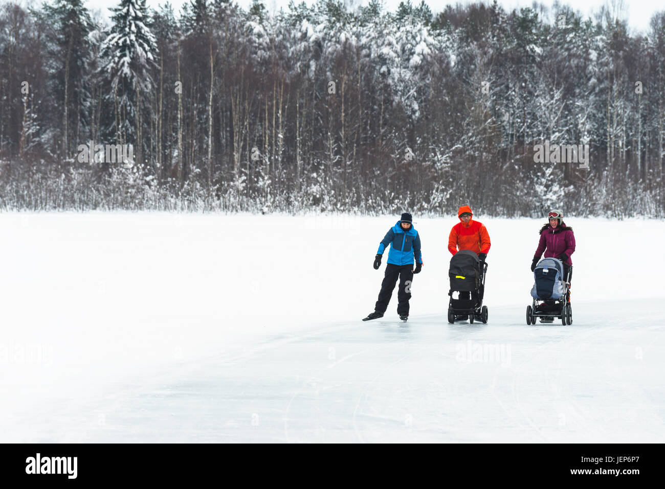 People ice-skating with buggies Stock Photo - Alamy