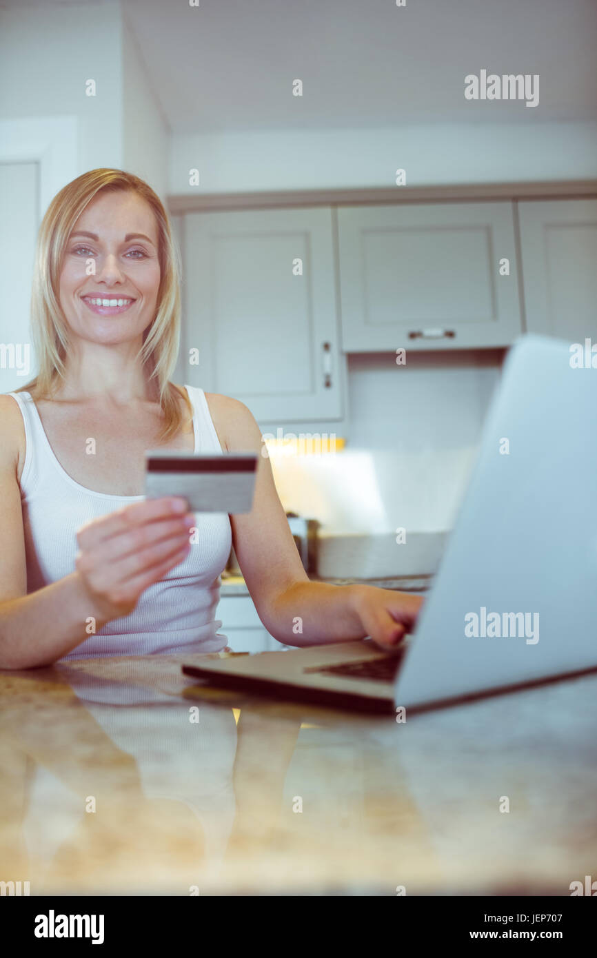 Pretty blonde woman ordering online Stock Photo - Alamy