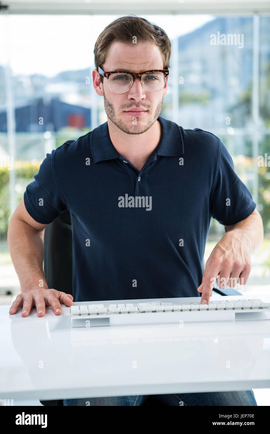 Handsome man using computer Stock Photo - Alamy