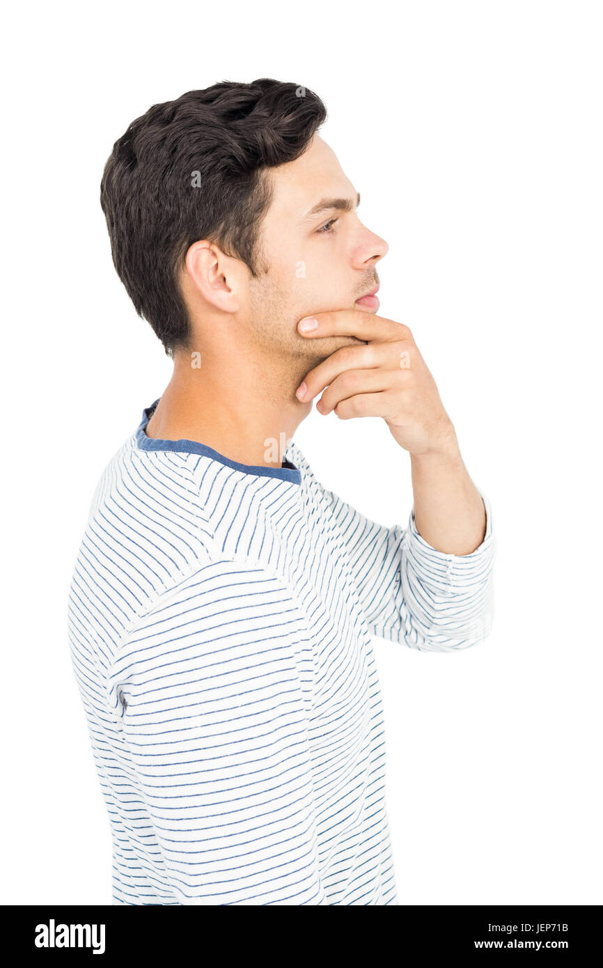 Man with hand on chin Stock Photo - Alamy